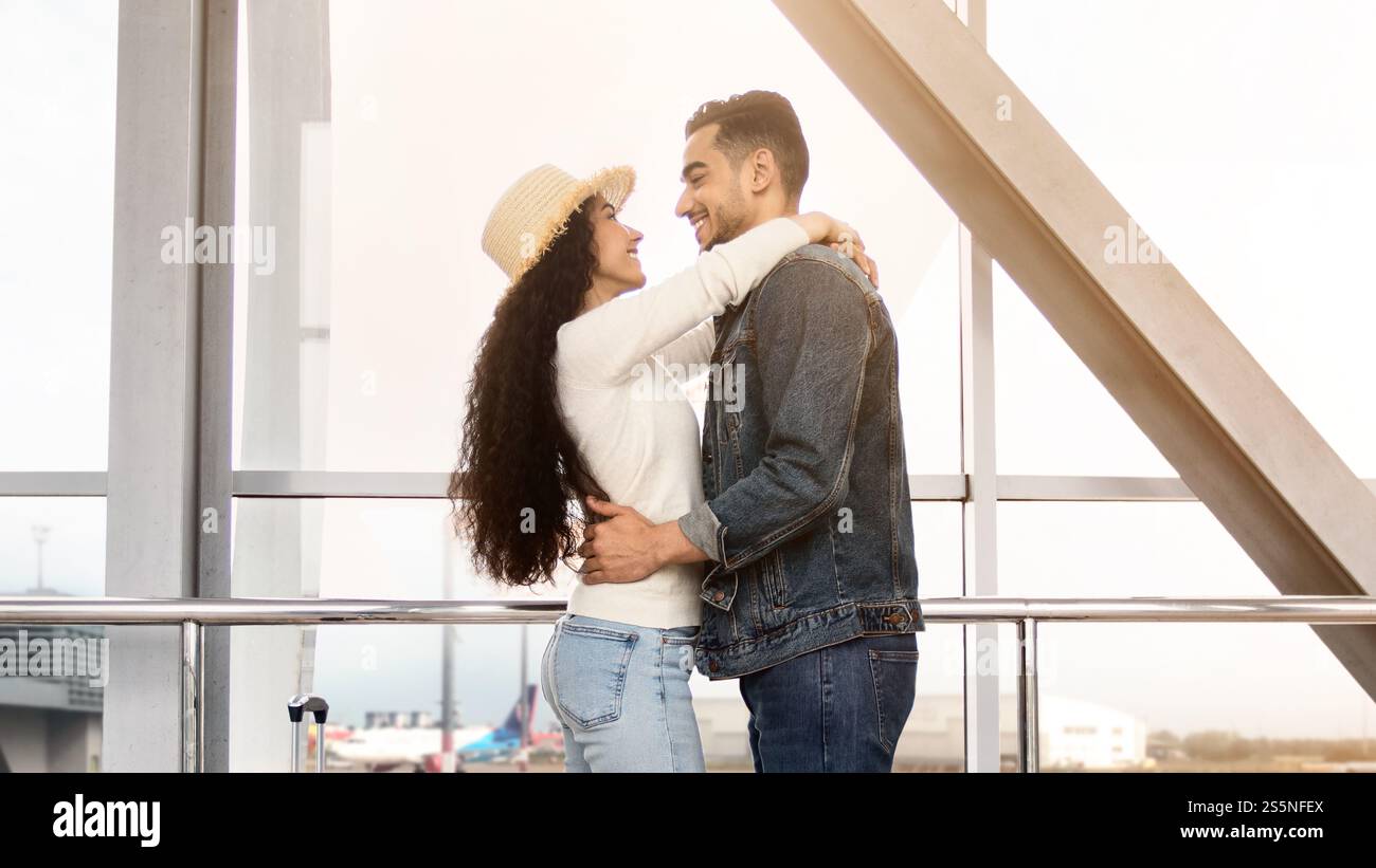 Romantic Arab Couple Hugging While Waiting For Flight In Airport ...