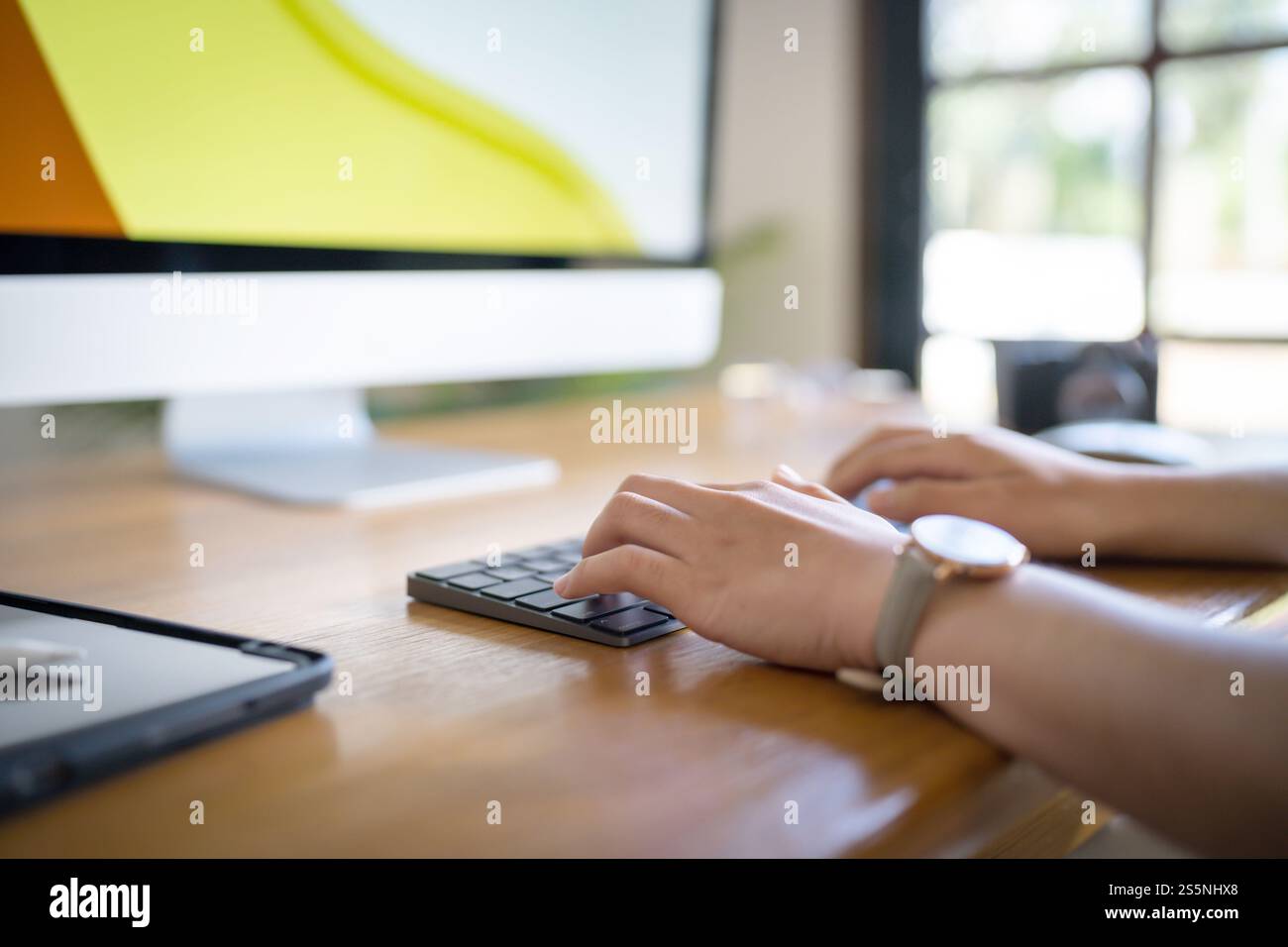 Graphic designer working on digital tablet and computer. Designer Asian ...