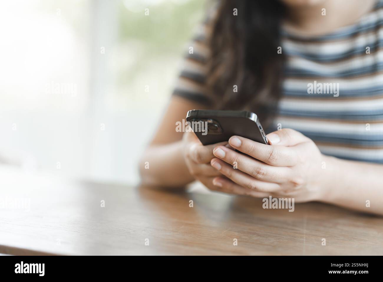 Womens Hands holding cell telephone working mobile devices. smart phone ...