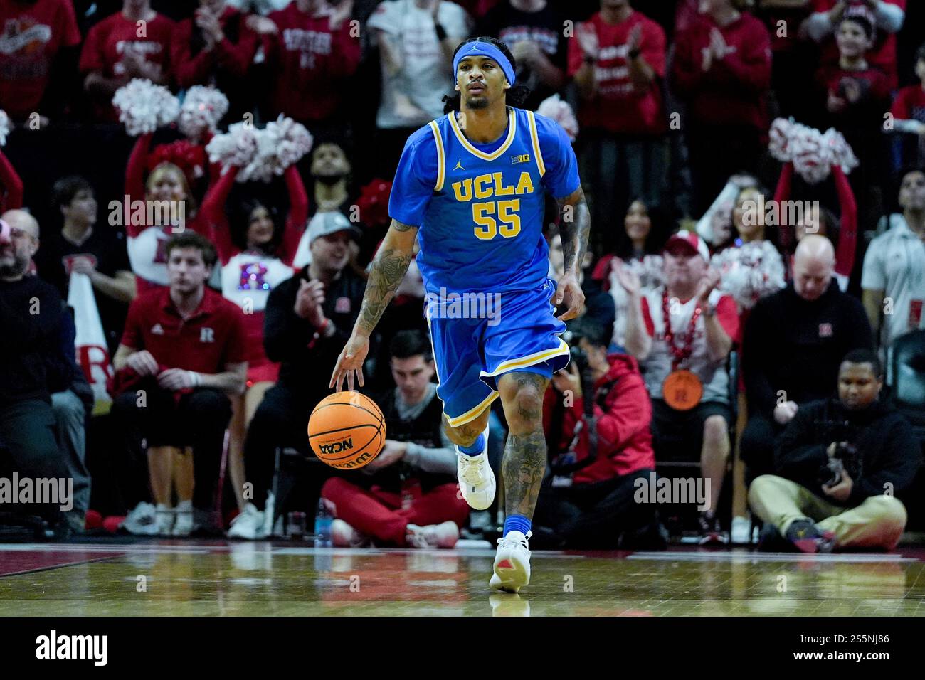 UCLA guard Skyy Clark (55) dribbles during an NCAA college basketball ...