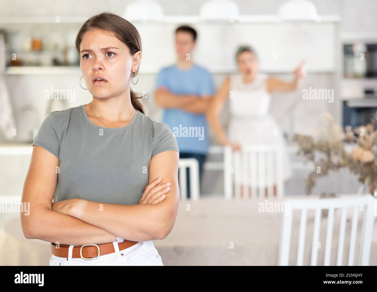 Woman and guy swear at girl. Mom and older brother scold young girl for ...