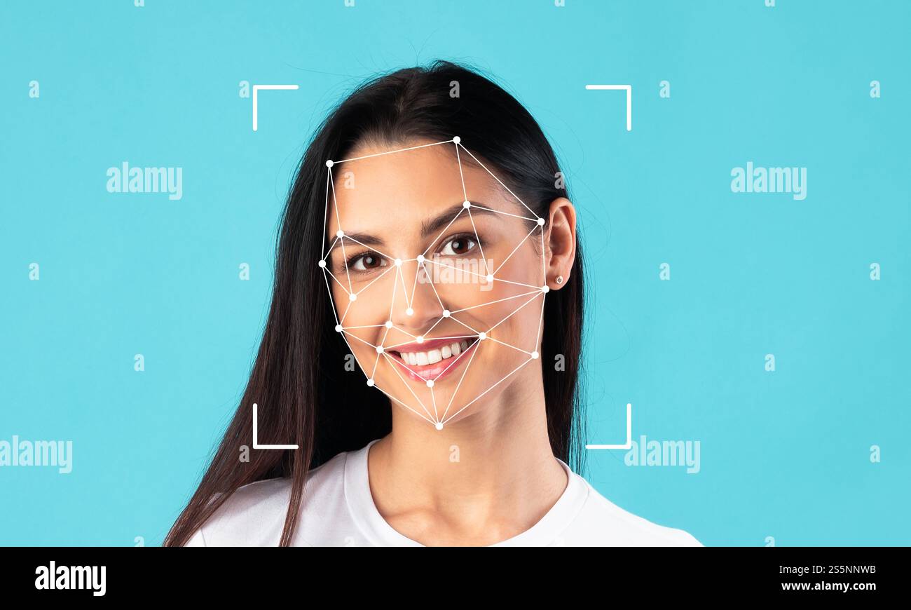 Facial recognition technology used on smiling woman against blue ...
