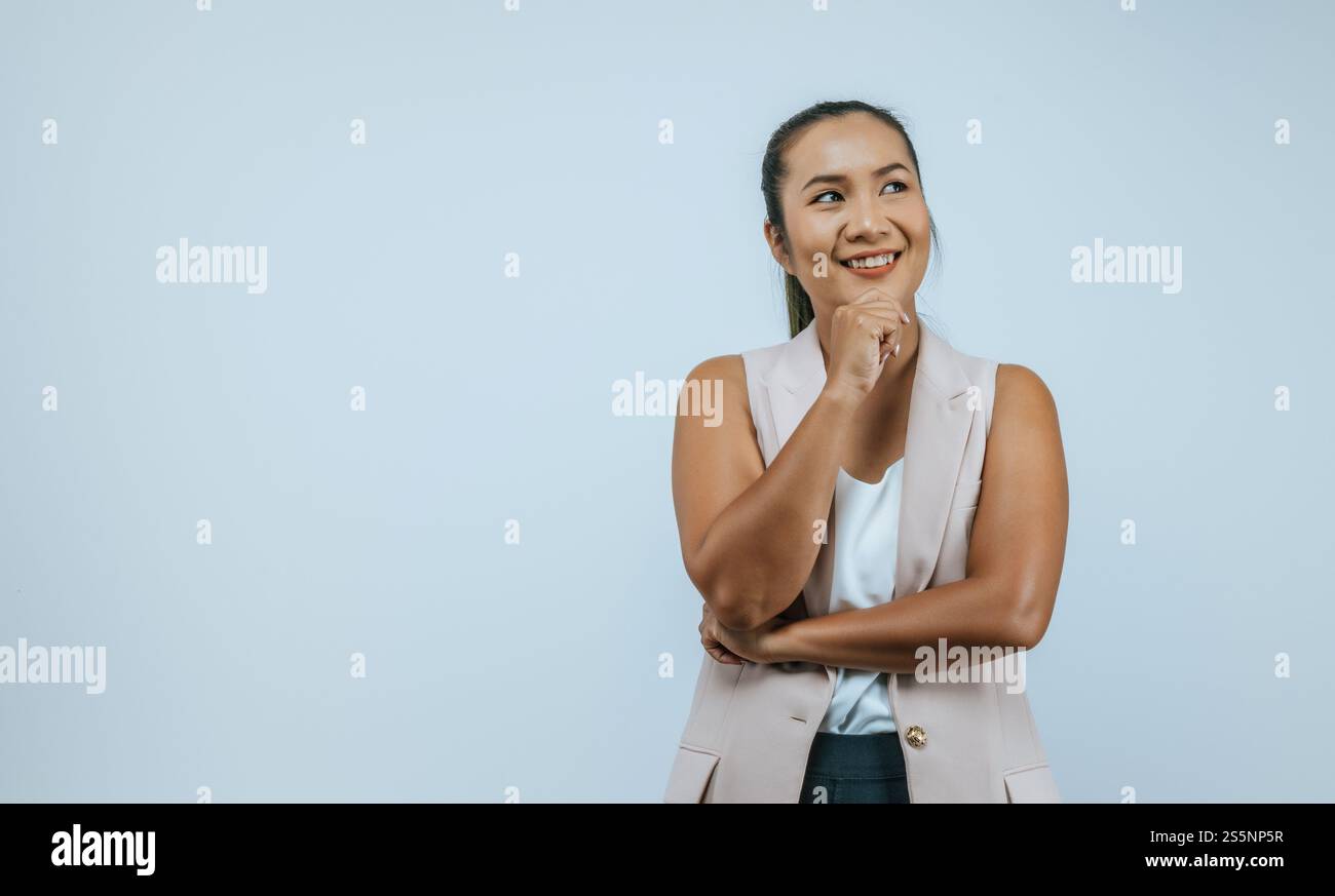 Portrait of smiling Asian woman 30s in casual clothes looking aside put ...