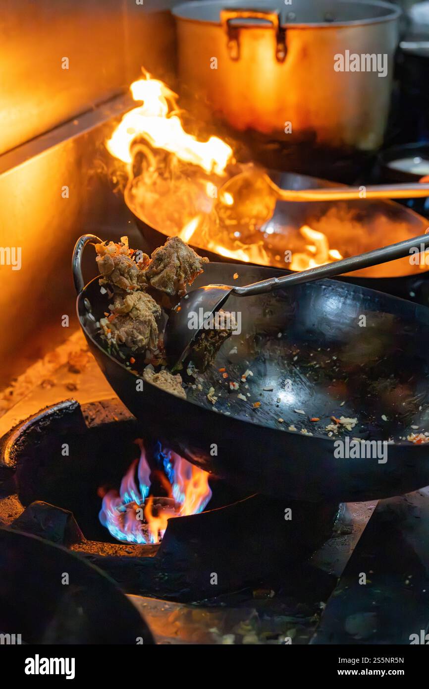 Wok cooking in a restaurant Stock Photo - Alamy