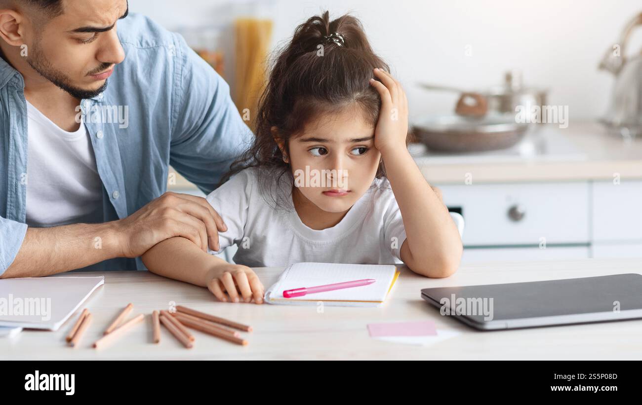 Young arab man single father comforting his upset daughter Stock Photo ...
