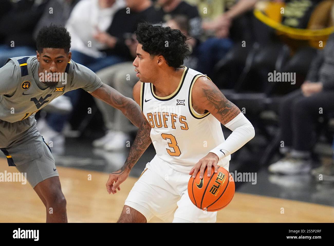 Colorado guard Julian Hammond III (3) and West Virginia guard Sencire ...