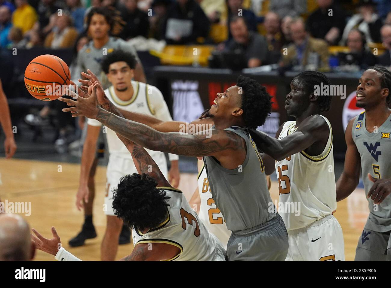 West Virginia forward Amani Hansberry (13) pursues a rebound in the ...