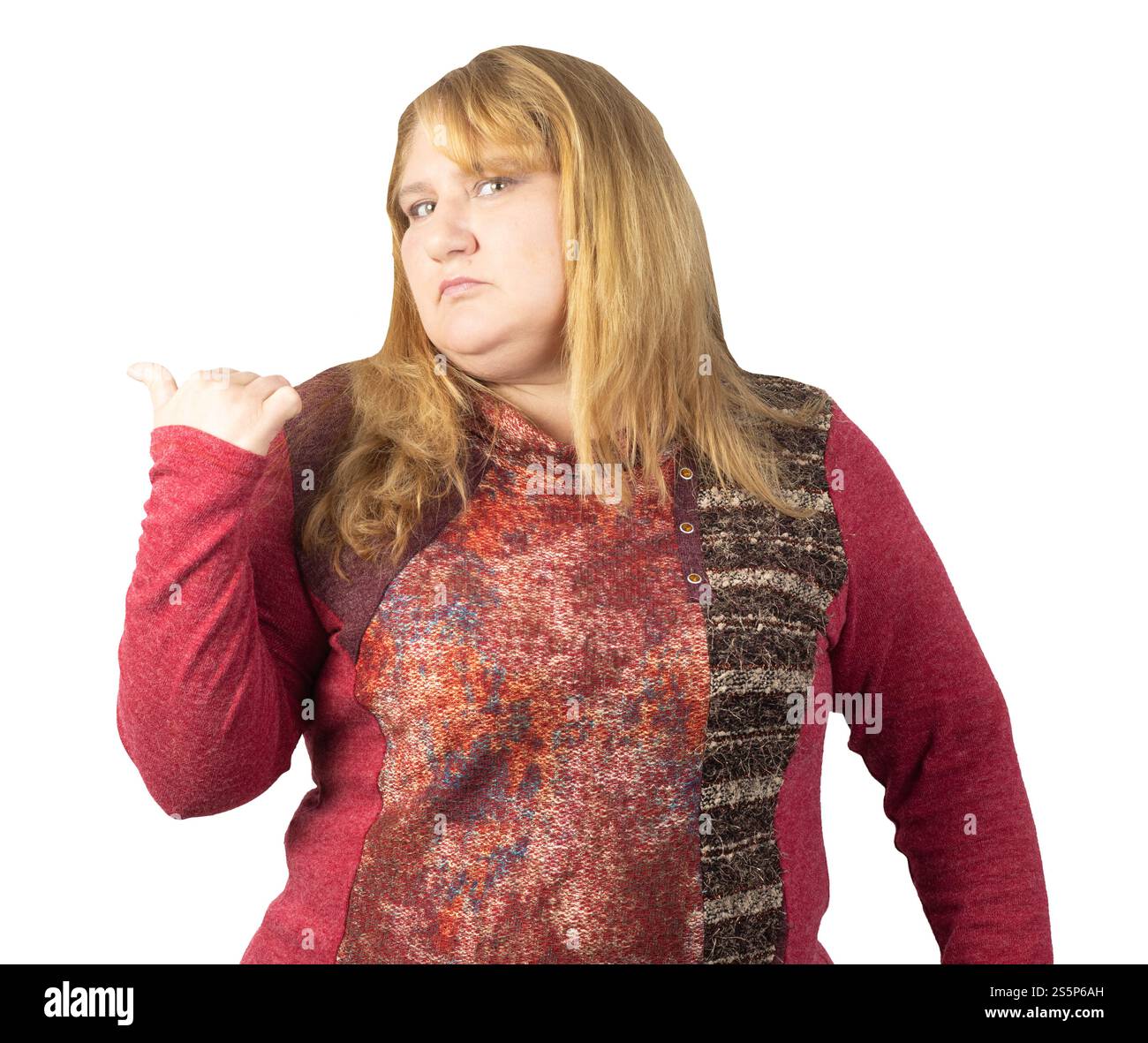 A middle-aged woman in a red patterned sweater points over her shoulder ...