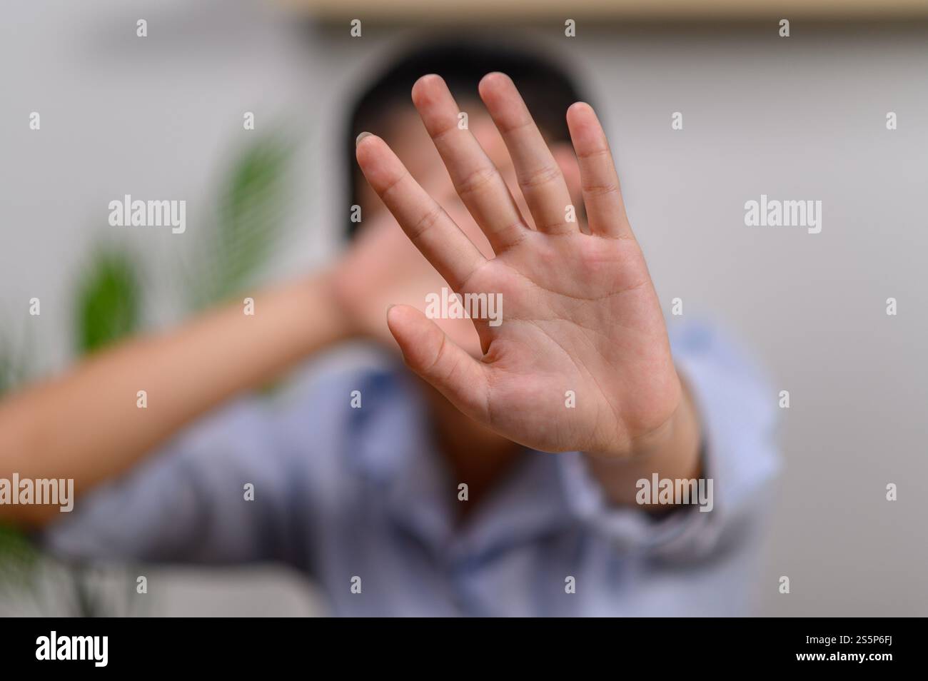 Young woman with making stop gesture with her palm outward. Selective ...