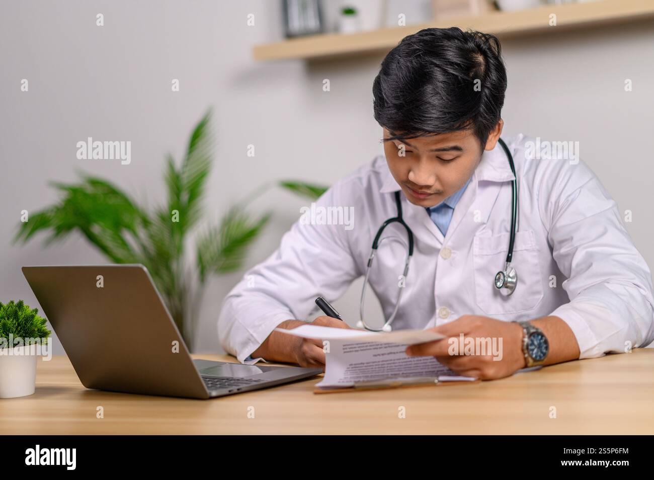 Male doctor headache in hospital hi-res stock photography and images ...
