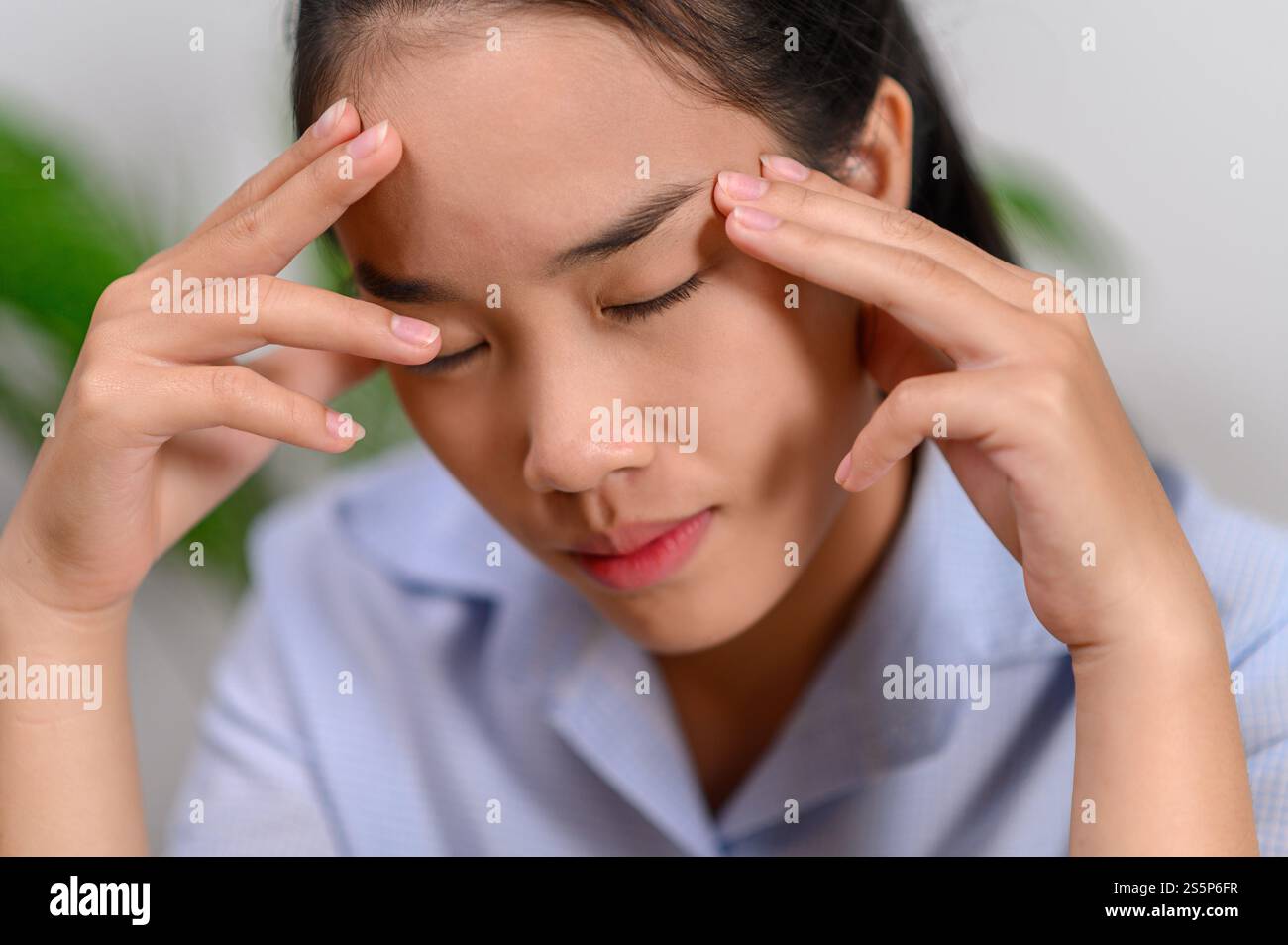 Female employee working and stressed at work Stock Photo - Alamy