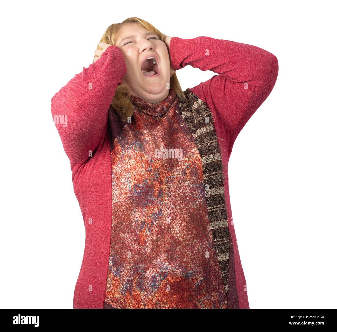 A middle-aged woman displaying a strong emotional reaction by screaming ...