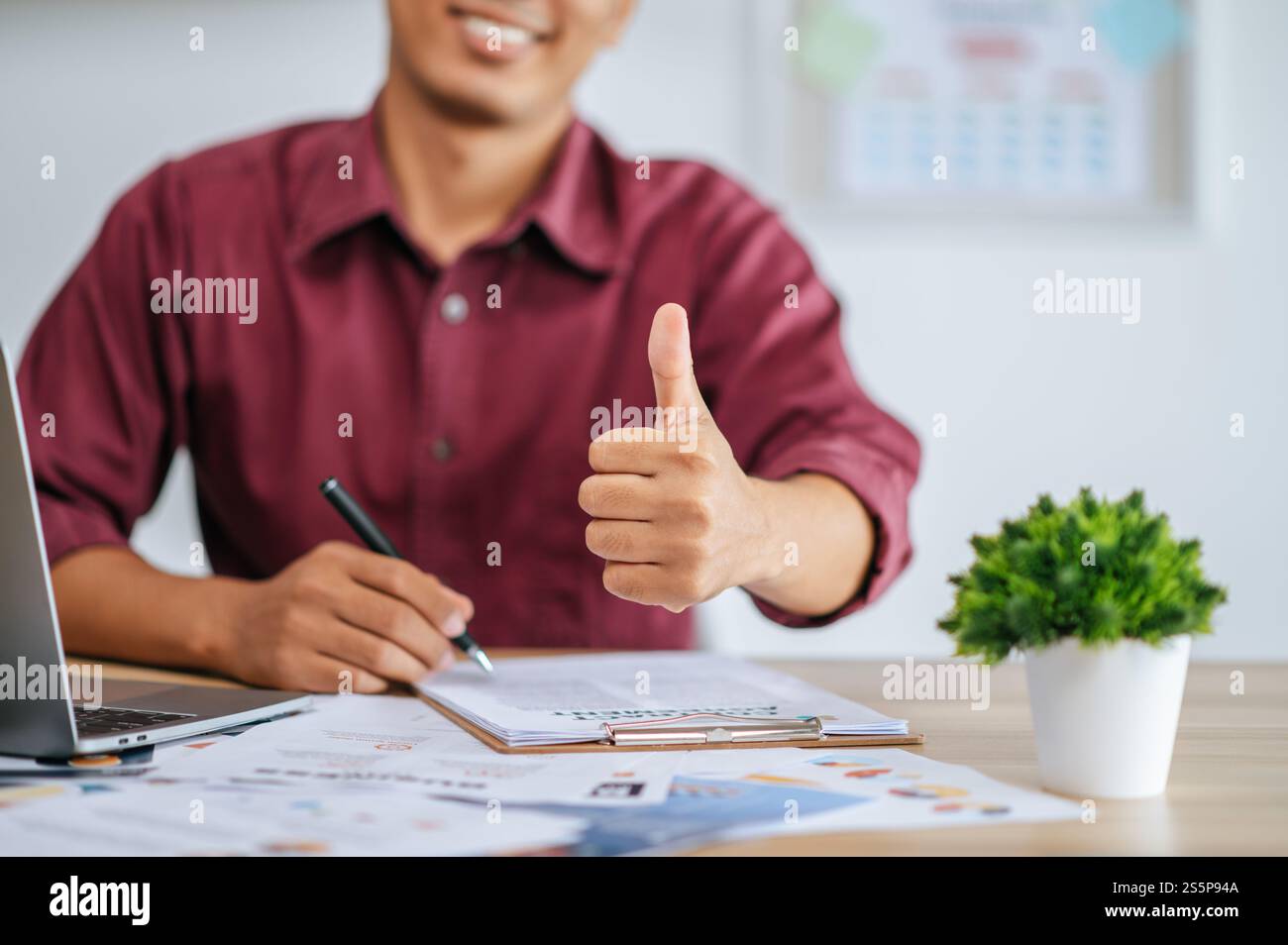 Thumbs up young businessman laptop hi-res stock photography and images ...