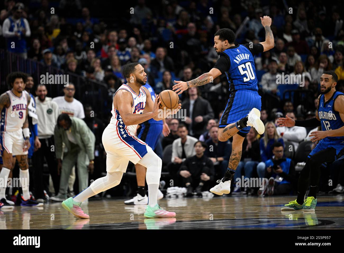 Philadelphia 76ers guard Eric Gordon, second from left, is defended by ...
