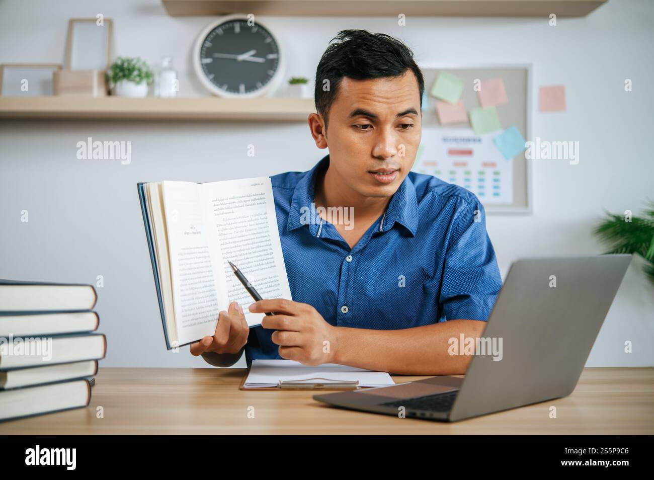 Happy latin guy working hi-res stock photography and images - Alamy