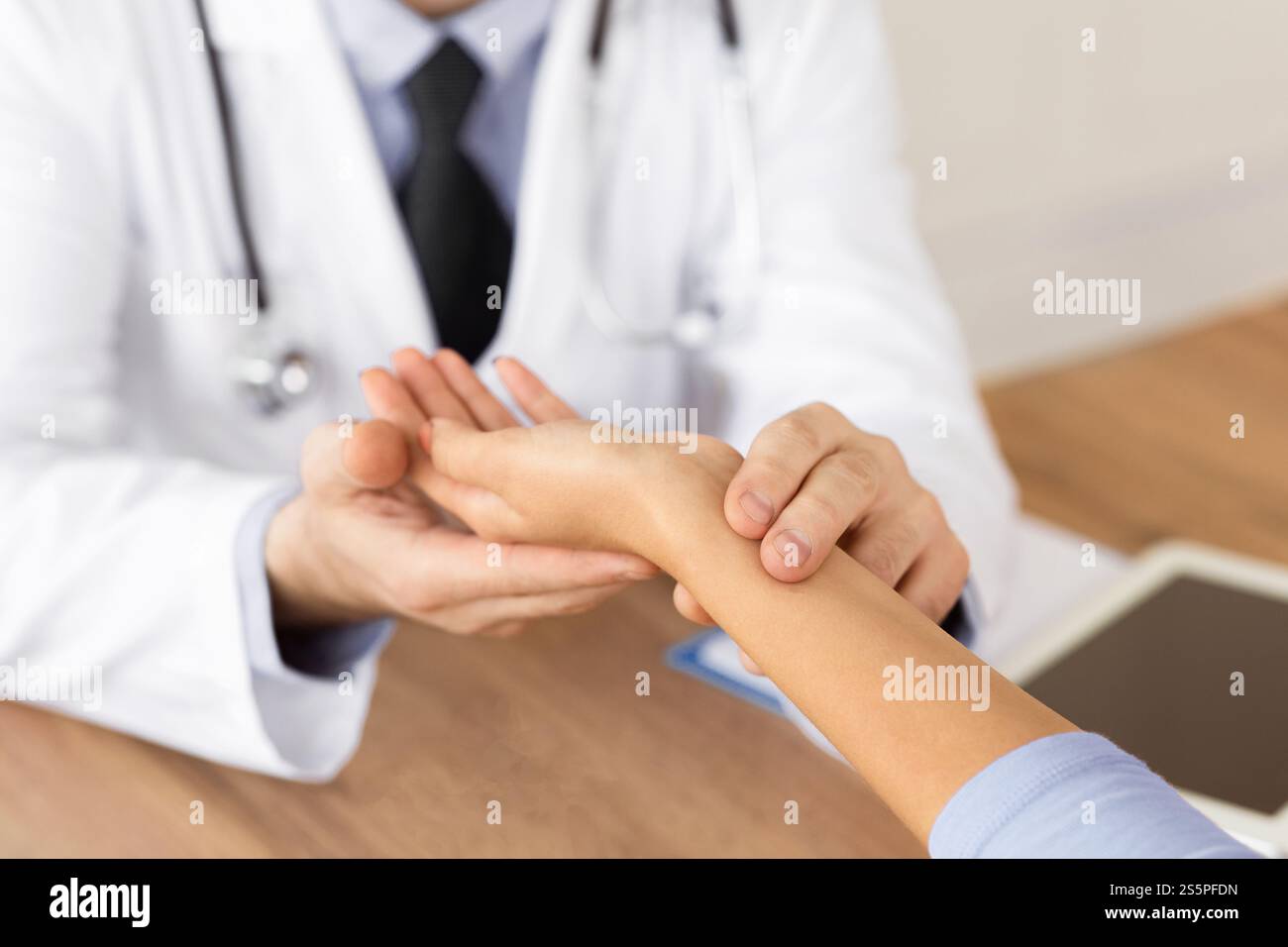 Doctor checking measuring pressure on patient's hand pulse Stock Photo ...
