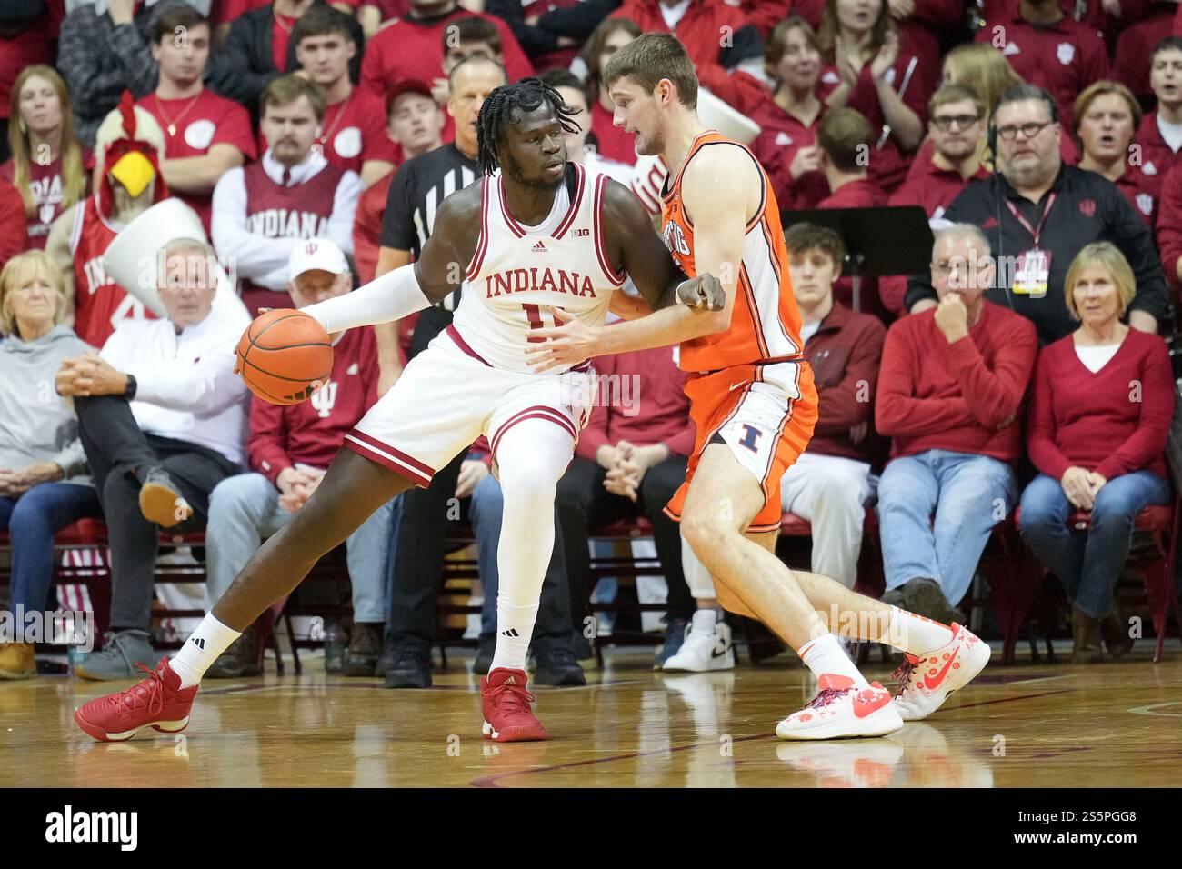 Indiana center Oumar Ballo , left, moves to the basket under the ...