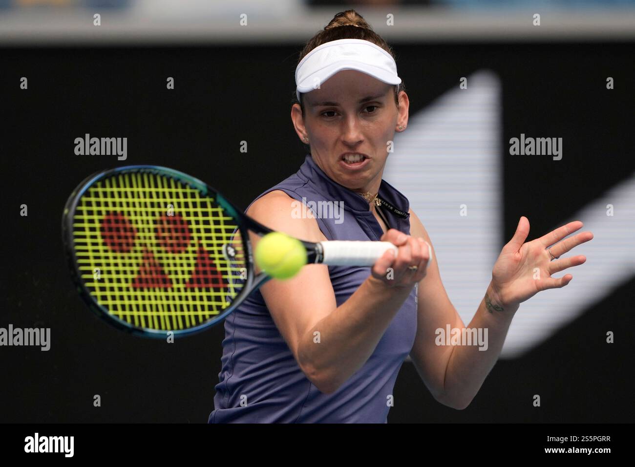 Elise Mertens of Belgium plays a forehand return to Jessica Pegula of ...