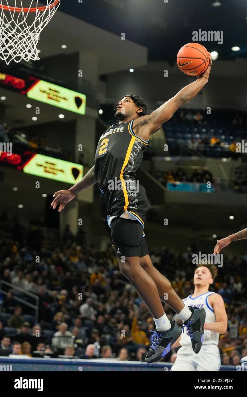 Marquette guard Chase Ross (2) dunks the basketball during the first ...