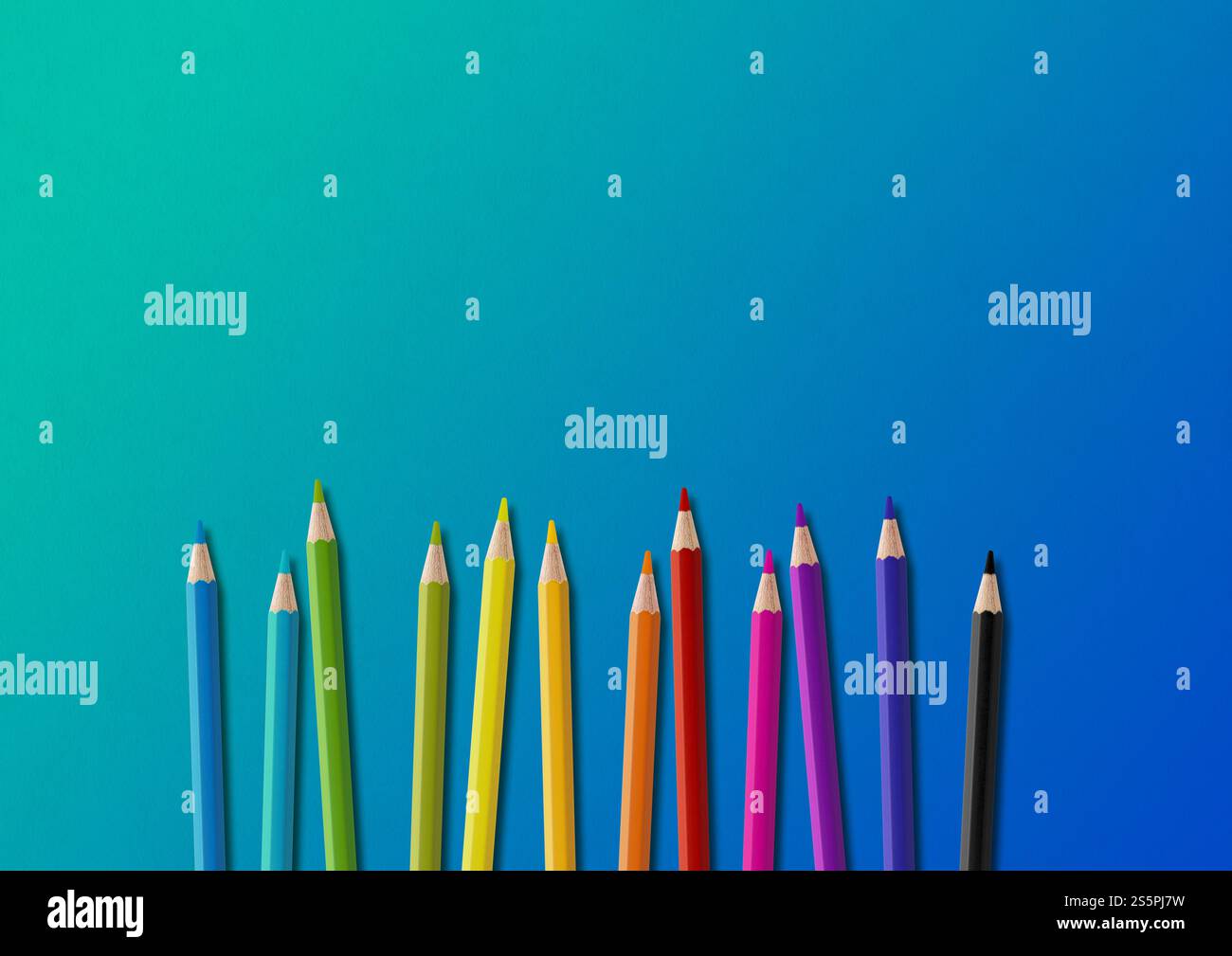 Wooden colored pencil set isolated on blue. Horizontal background ...