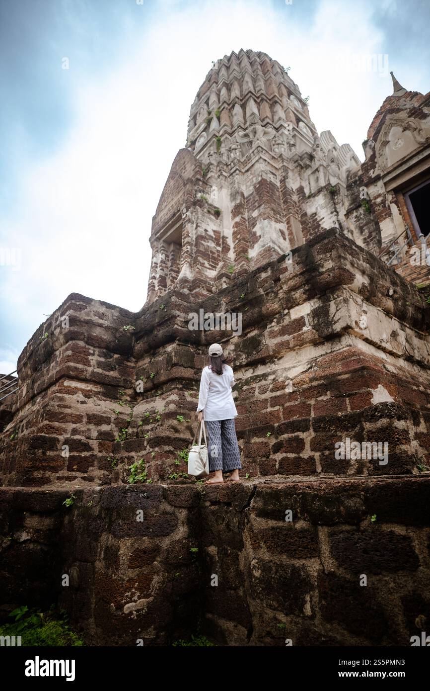 Summer Travel archaeological site in Asia. Asian woman traveler temple ...