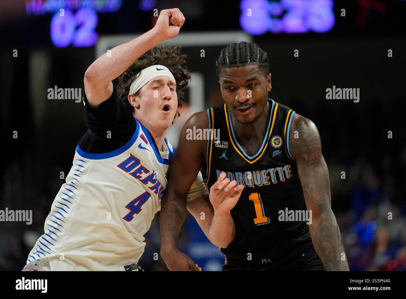 DePaul guard Conor Enright (4) guards Marquette guard Kam Jones (1 ...