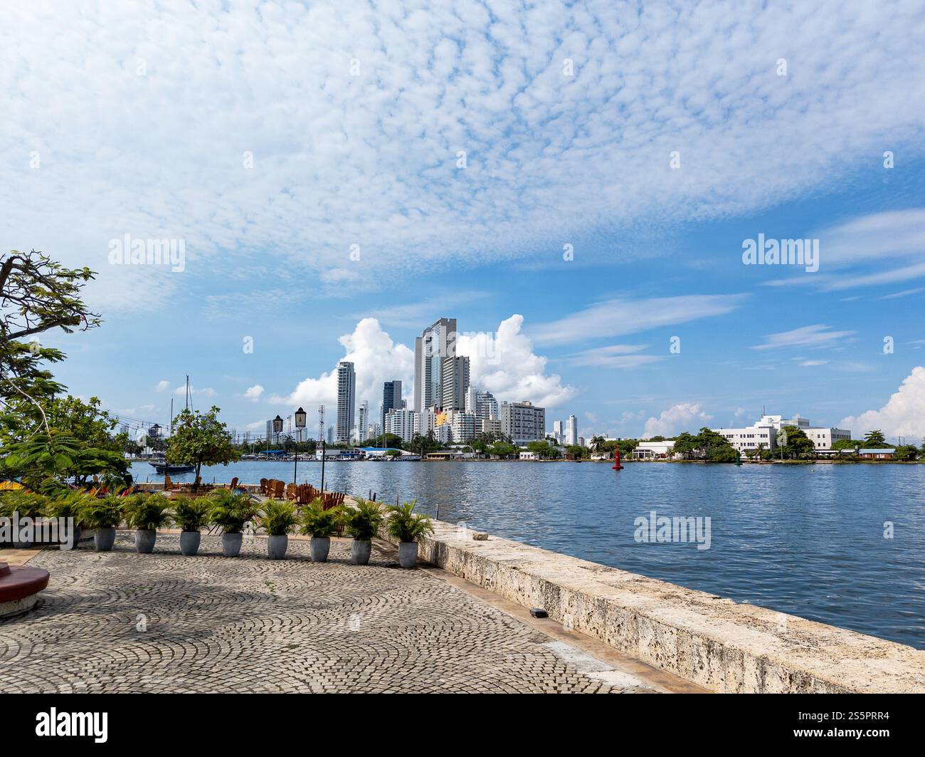 A captivating view of Cartagena modern skyline, showcasing high-rise buildings reflecting on the ...
