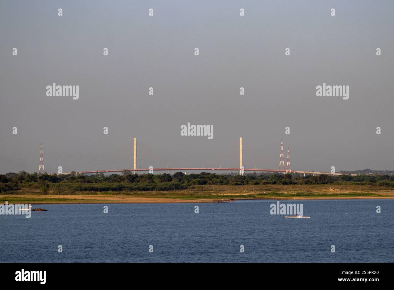 A serene view of Asuncion, Paraguay, featuring the iconic bridge over ...