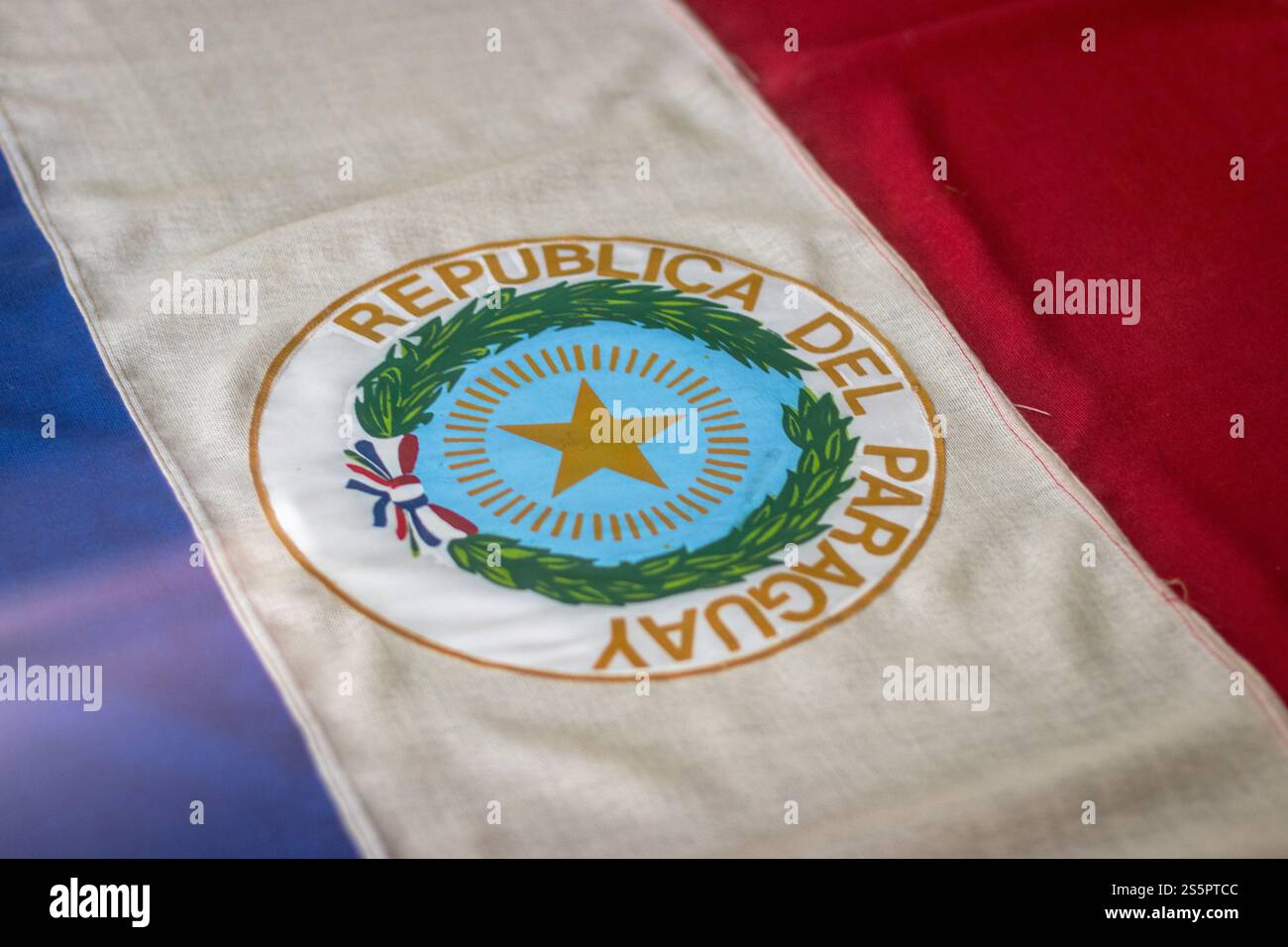 Close-up image of the Paraguayan flag featuring the national emblem and ...