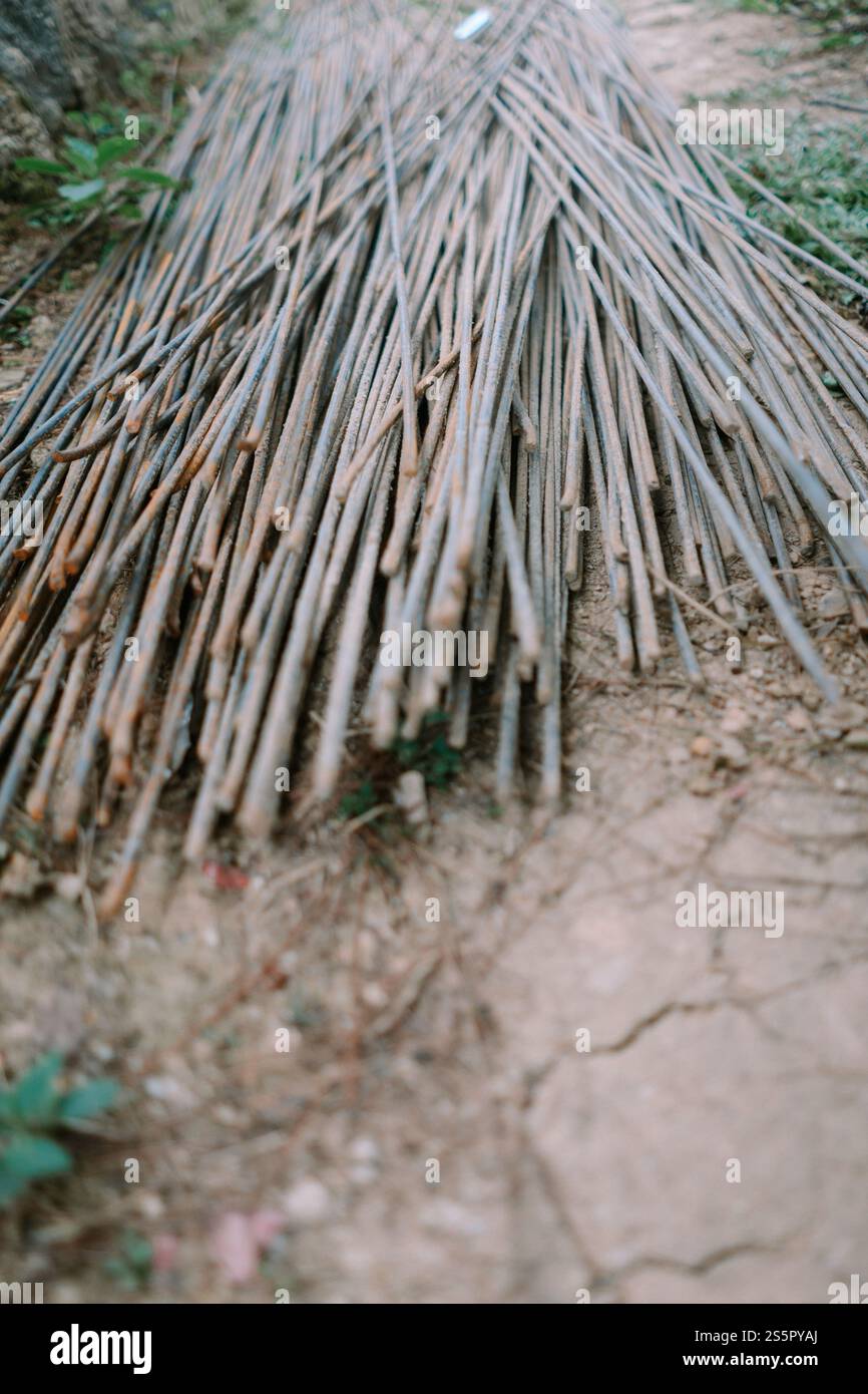 Pile of steel reinforcement rods at a construction site, ready for ...
