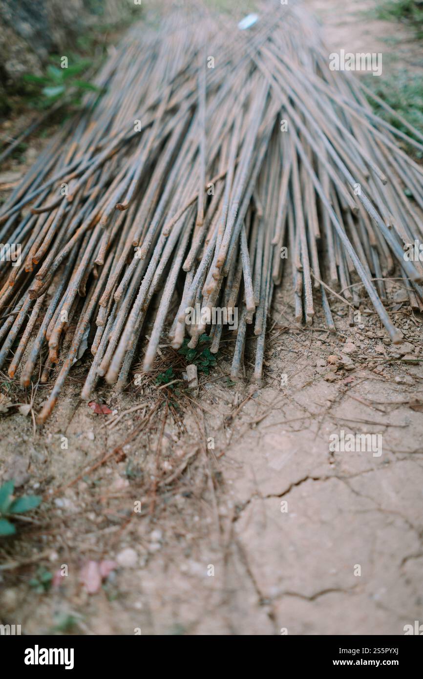 Pile of steel reinforcement rods at a construction site, ready for ...