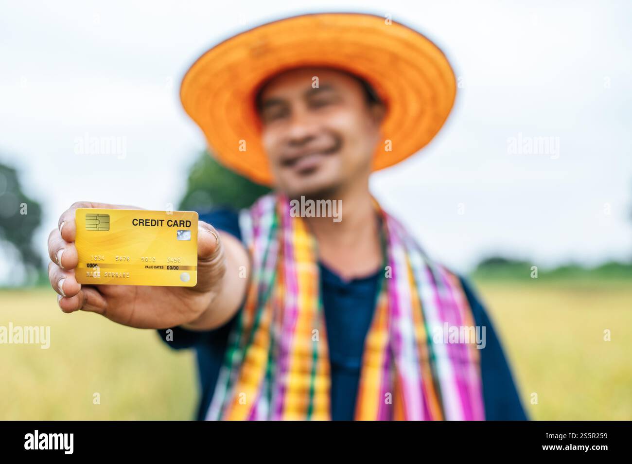 Selective focus credit card in asian rich farmer hand hi-res stock ...