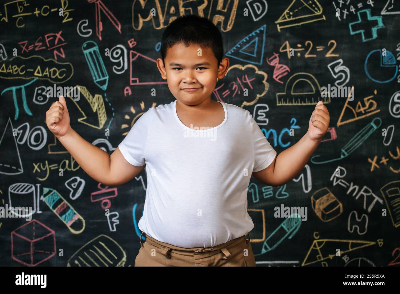 Child standing and acting in the classroom Stock Photo - Alamy