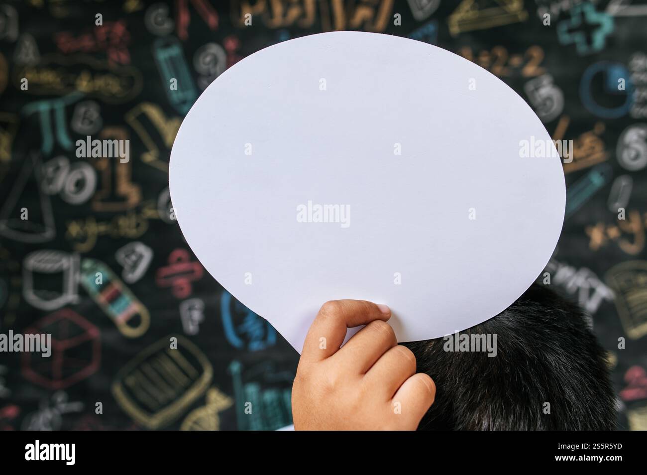 hand holding speech bubble in class room Stock Photo - Alamy