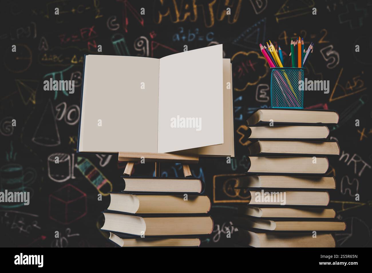 Colored pencils in the box and books in the classroom Stock Photo - Alamy
