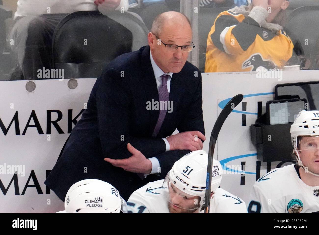 Seattle Kraken head coach Dan Bylsma stands behind his bench during the ...