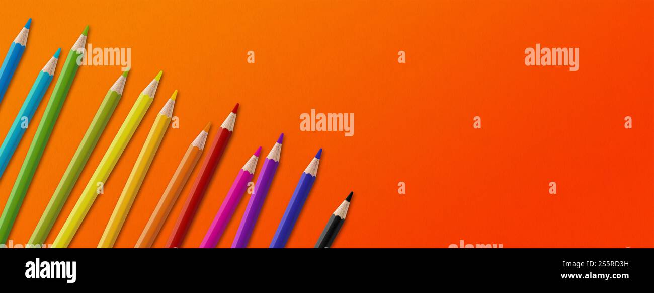 Wooden colored pencil set isolated on orange. Panoramic banner ...
