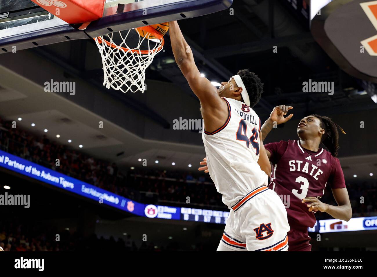 Auburn center Dylan Cardwell (44) slam dunks the ball as Mississippi ...