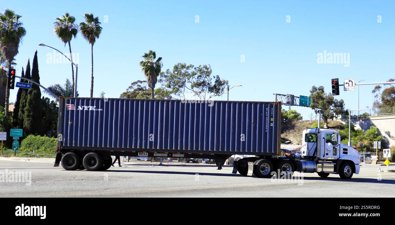 Freight Truck carrying a NYK LINE shipping container on a street toward ...