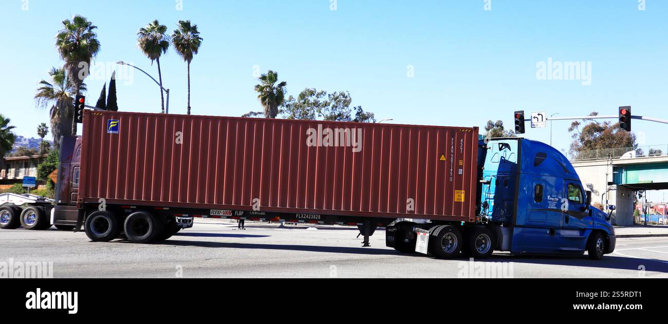 Freight Truck carrying a FLORENS shipping container on a street toward ...