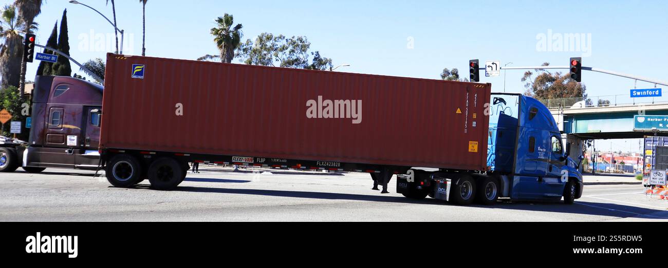 Freight Truck carrying a FLORENS shipping container on a street toward ...