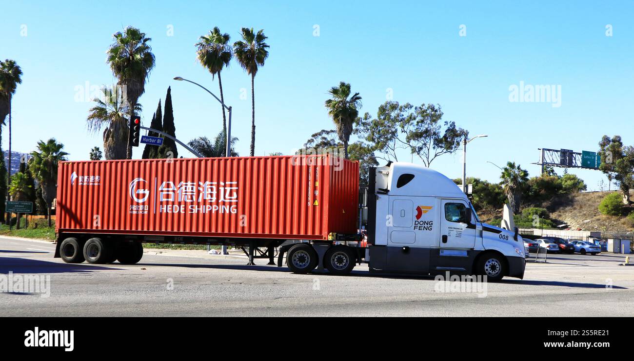 Freight Truck carrying an HEDE SHIPPING shipping container on a street ...