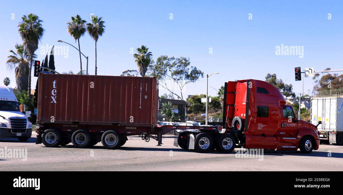 Freight Truck carrying a TEX shipping container on a street toward the ...