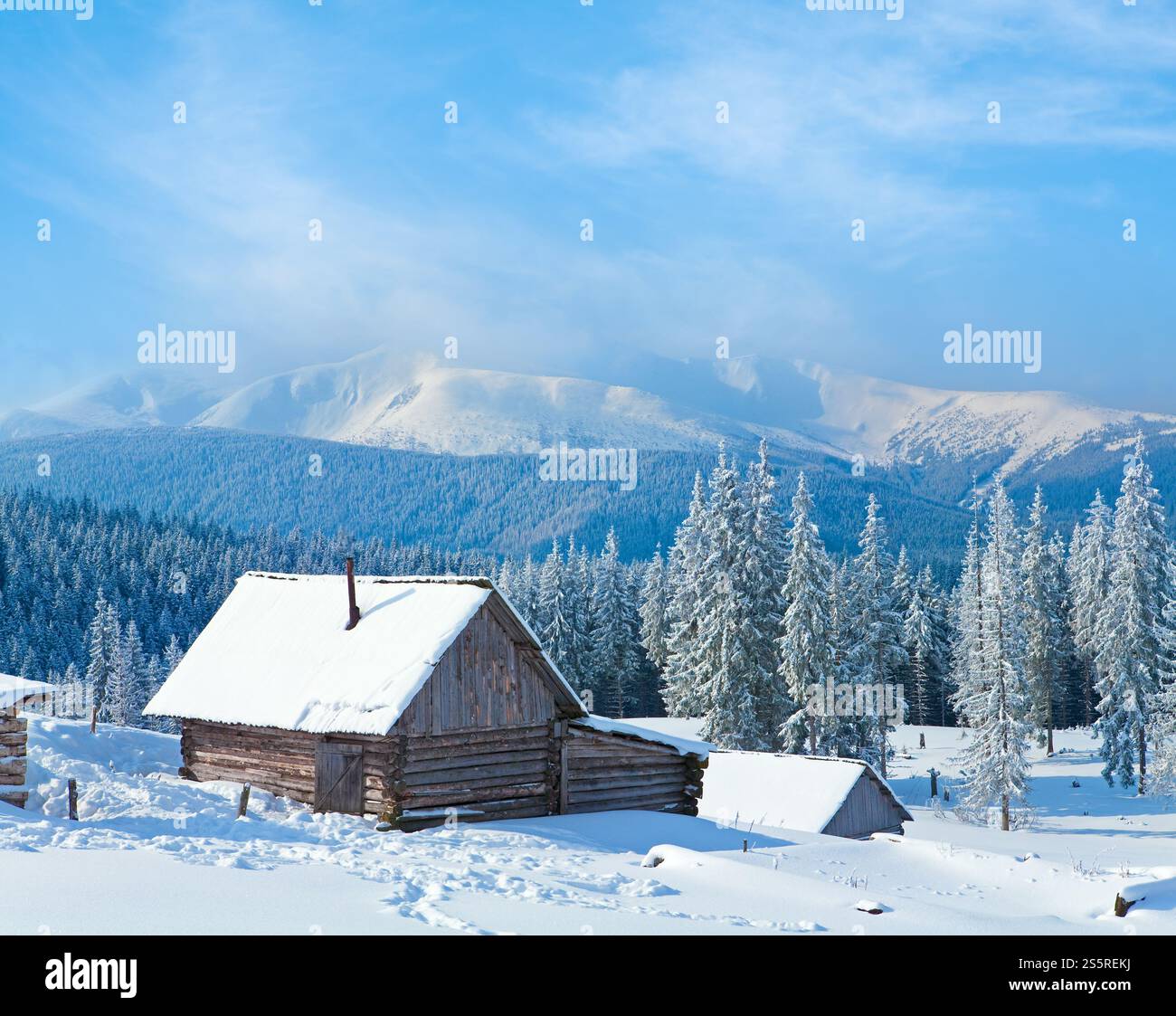 Winter calm mountain landscape with shed and mount ridge behind (Kukol ...