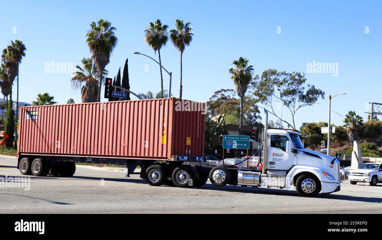 Freight Truck carrying a BEACON shipping container on a street toward ...