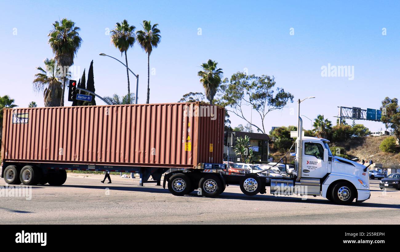 Freight Truck carrying a BEACON shipping container on a street toward ...