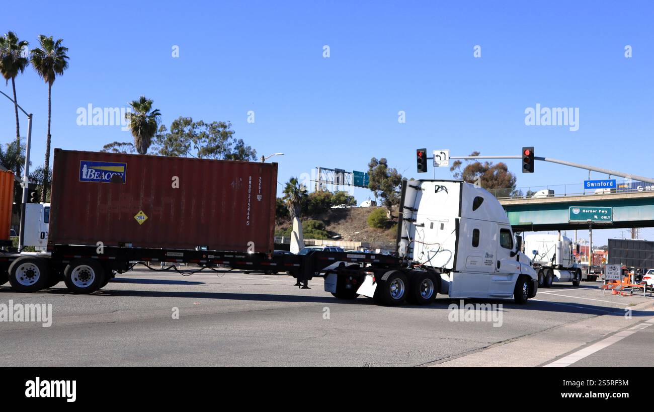 Freight Truck carrying a BEACON shipping container on a street toward ...