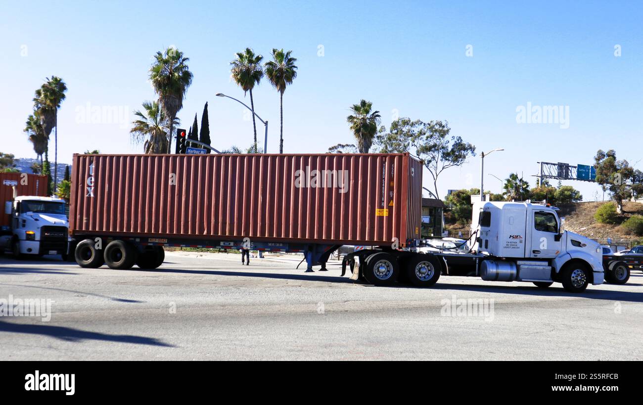 Freight Truck carrying a TEX shipping container on a street toward the ...