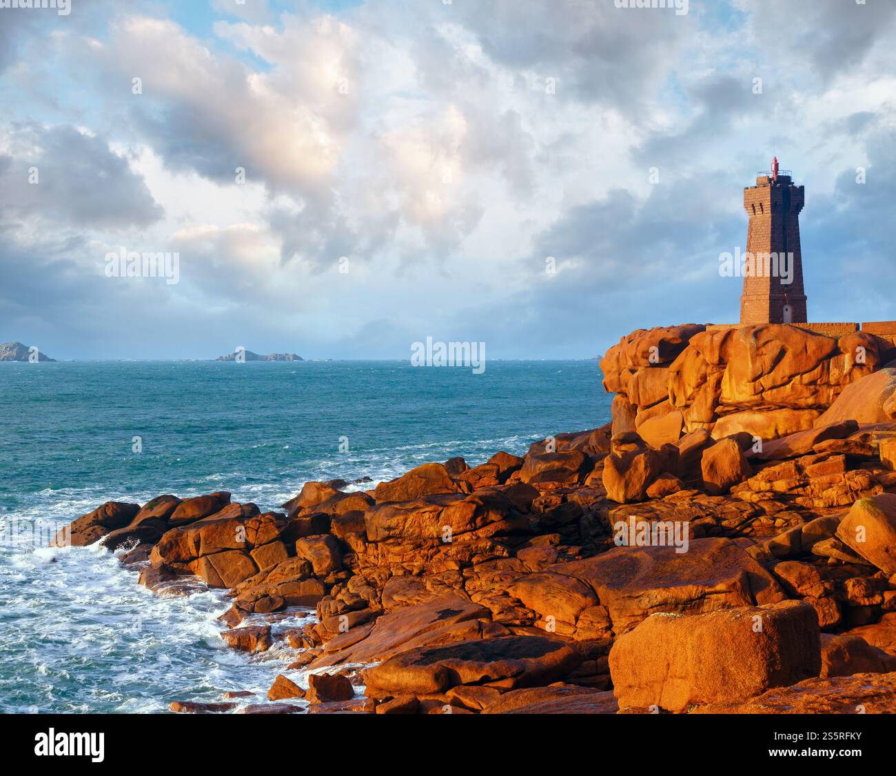 Ploumanach lighthouse sunset view (Perros-Guirec, Brittany, France). The Pink Granite Coast ...