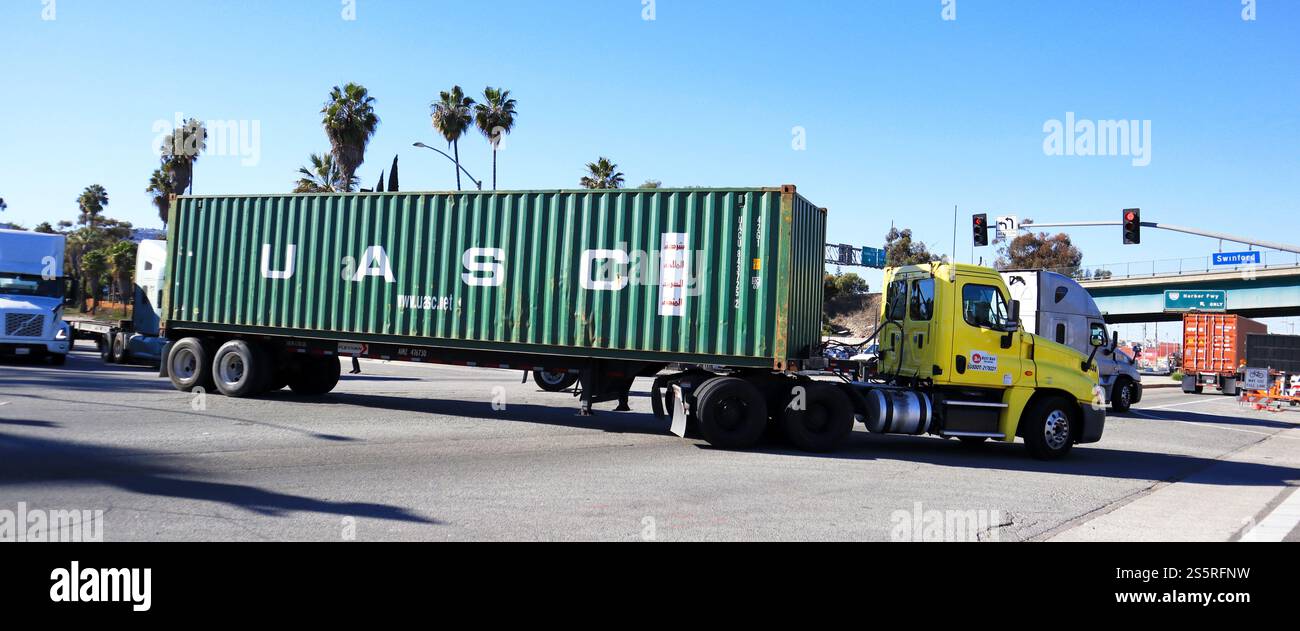 Freight Truck carrying an UASC shipping container on a street toward ...
